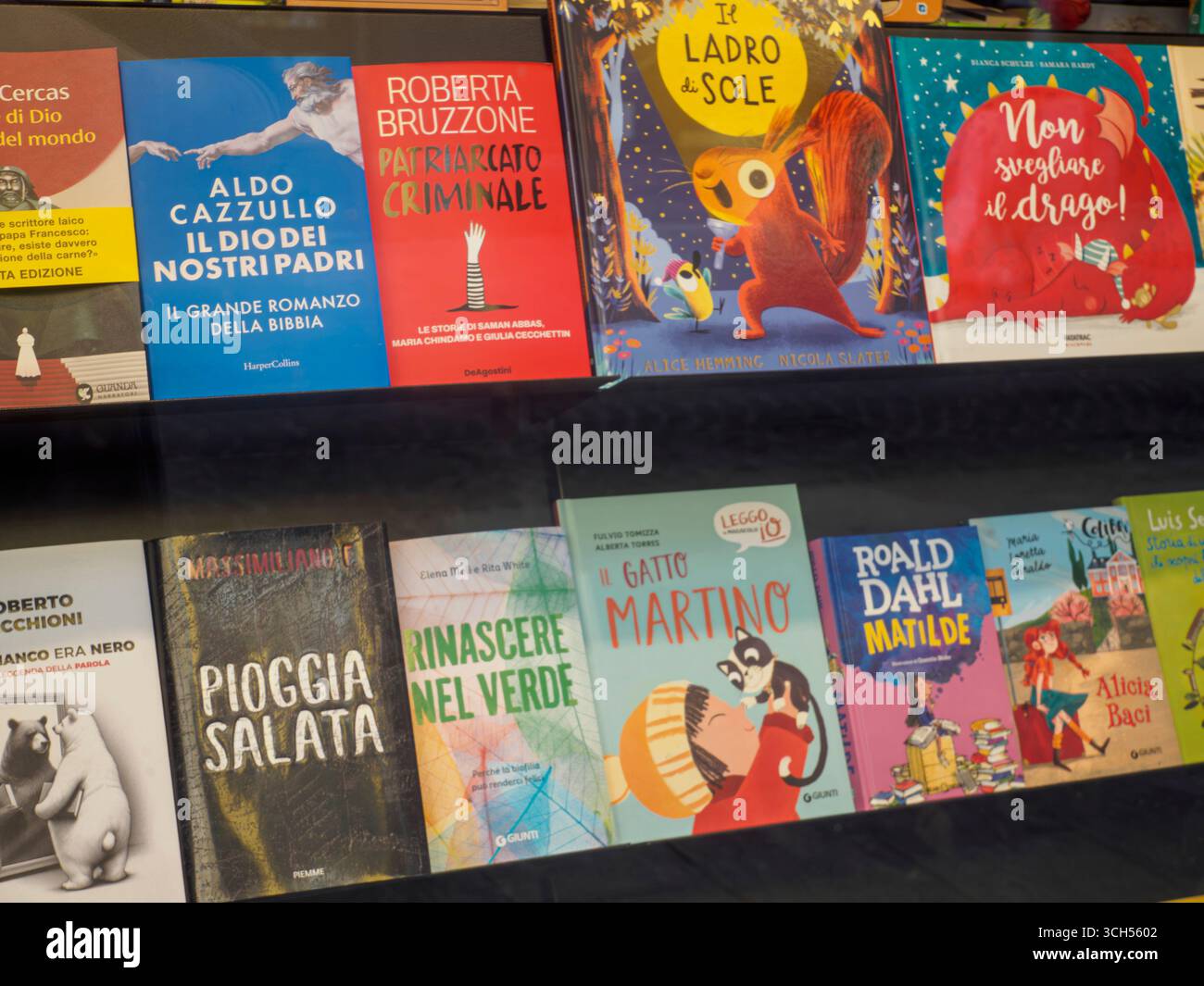 Milan, Italy August 14th 2025 Colorful books with intriguing titles are ...