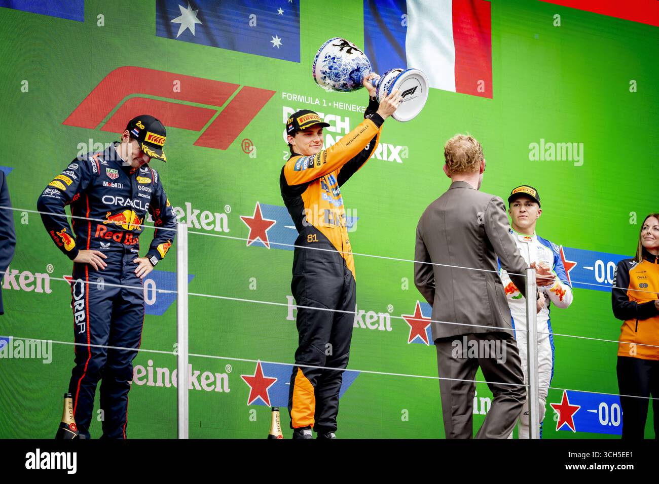 ZANDVOORT - Max Verstappen, Oscar Piastri, and Isack Hadjar on the podium after the Dutch F1 ...