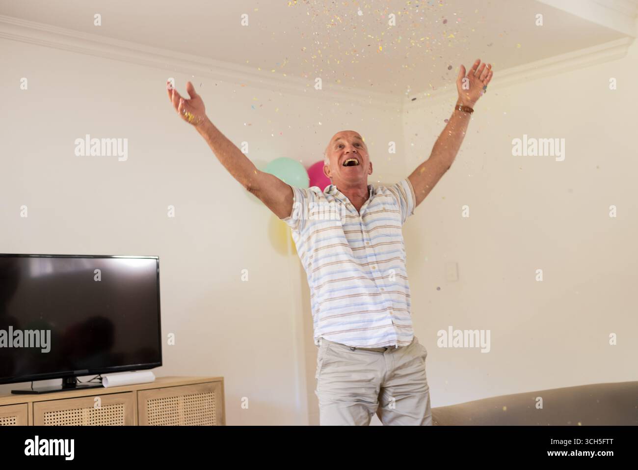 Celebrating confetti balloons senior hi-res stock photography and ...