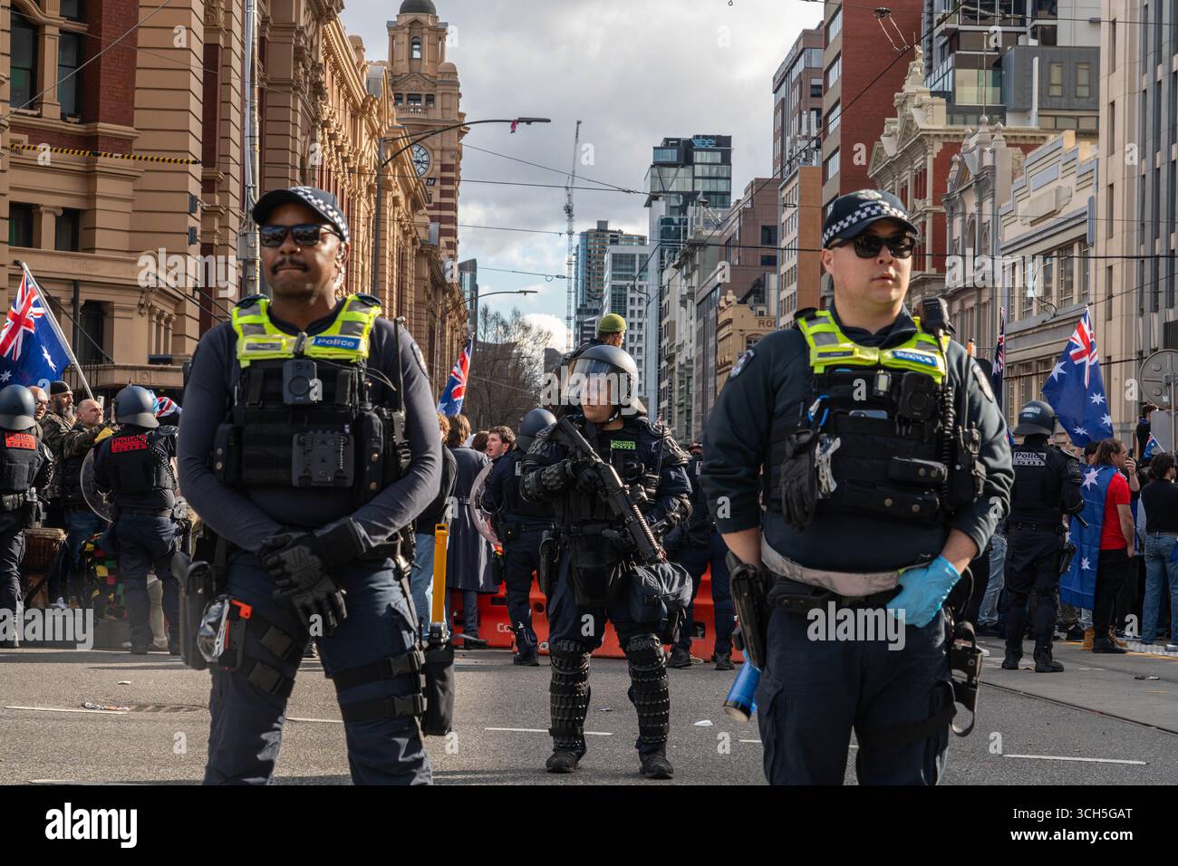 Police officers are seen blocking the crowds during the anti ...