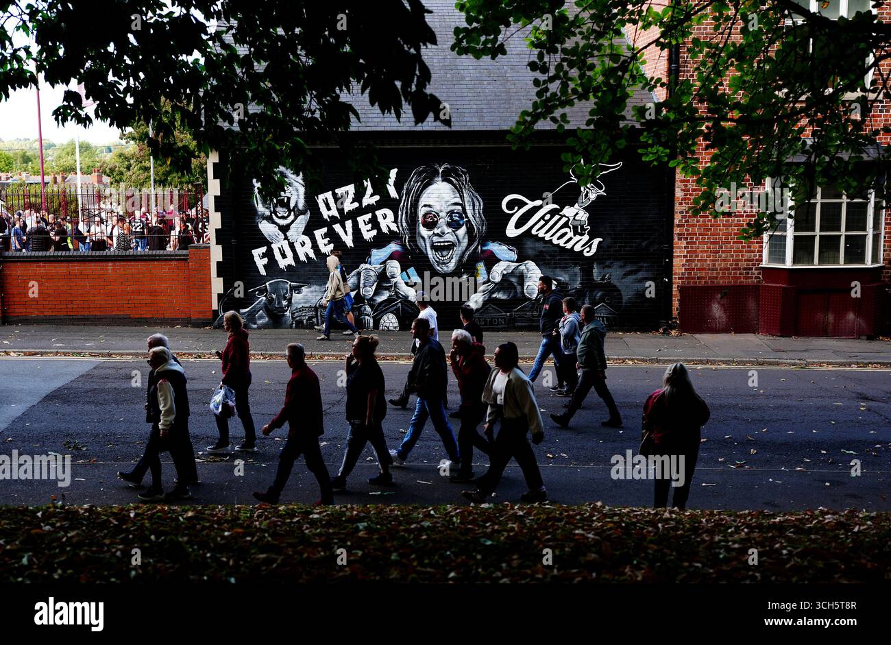 Aston Villa fans walk past a mural dedicated to Ozzy Osbourne near the ...