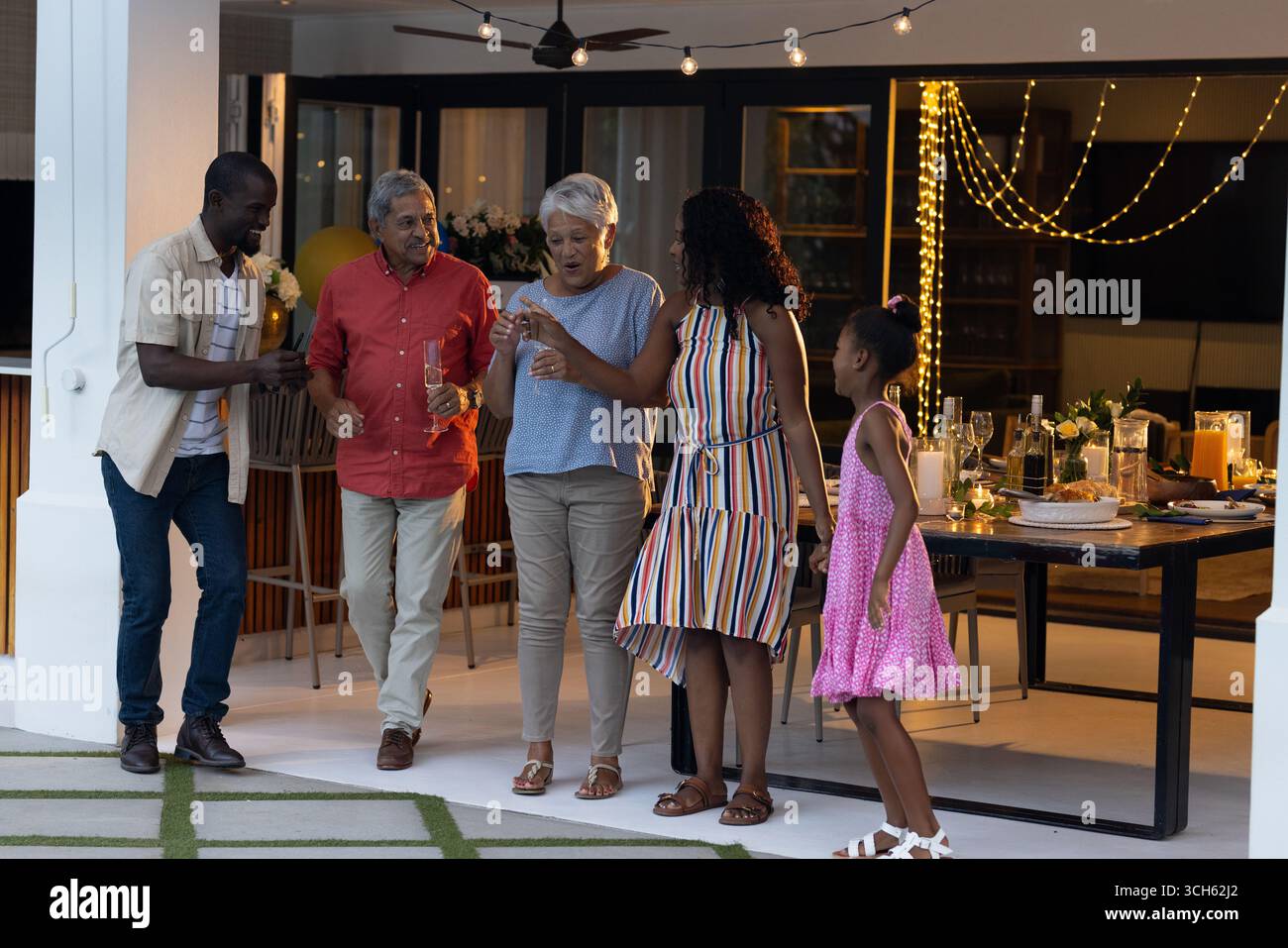 Multigenerational family celebrating together hi-res stock photography ...