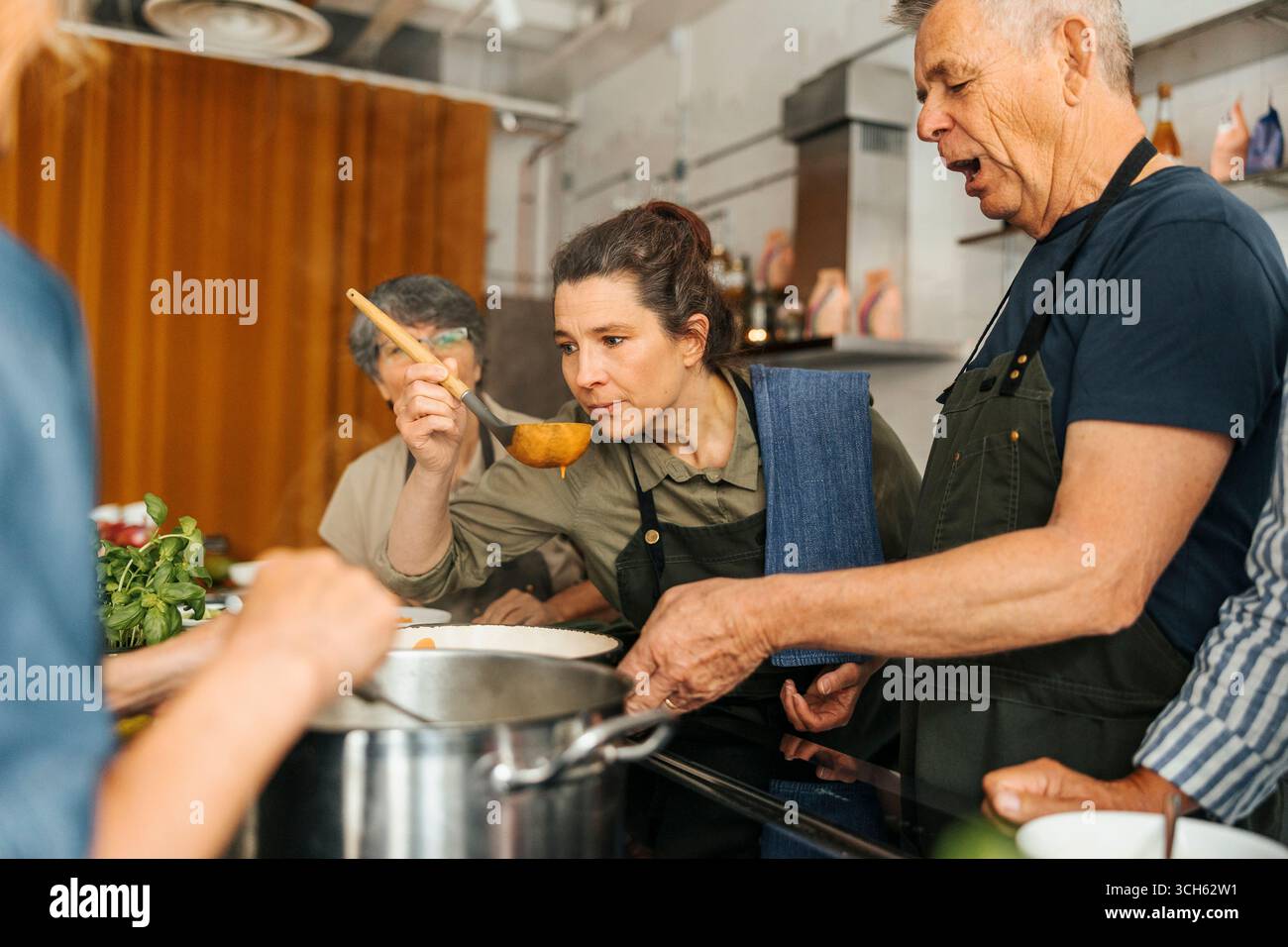 Female chef smelling sauce hi-res stock photography and images - Alamy