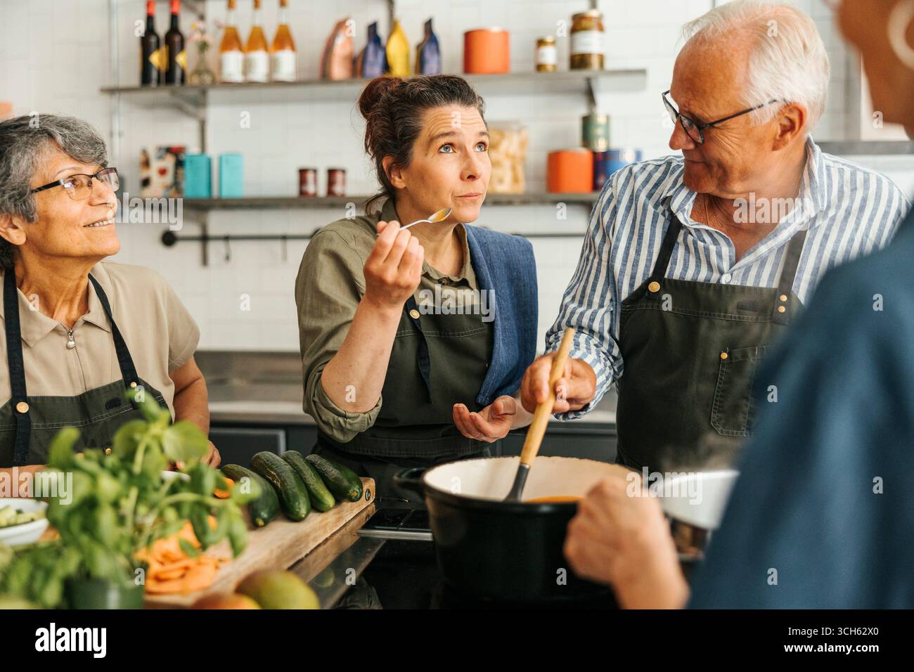Female chef tasting sauce hi-res stock photography and images - Alamy