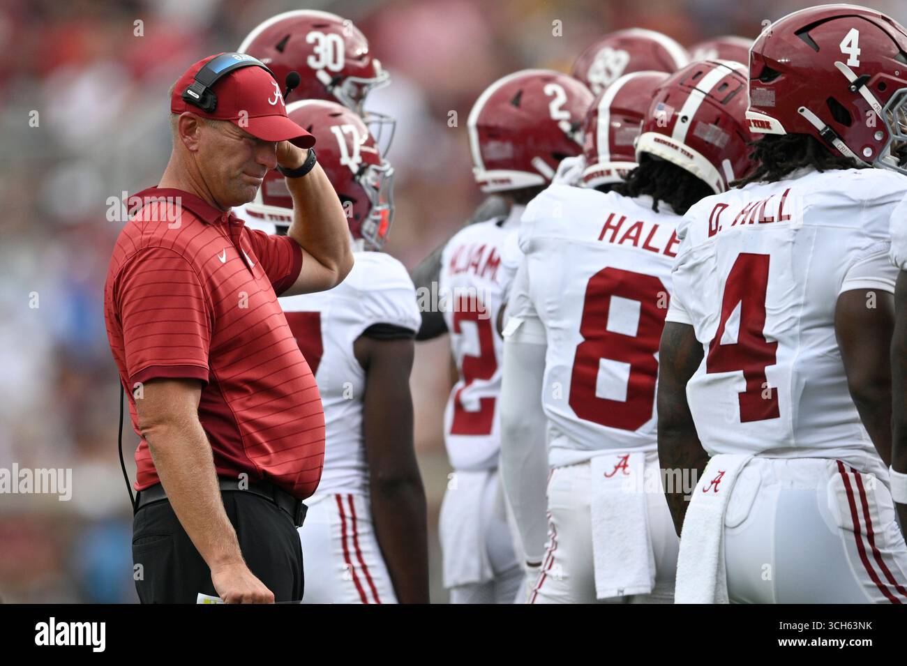 Alabama head coach Kalen DeBoer, left, stands on the field during a ...