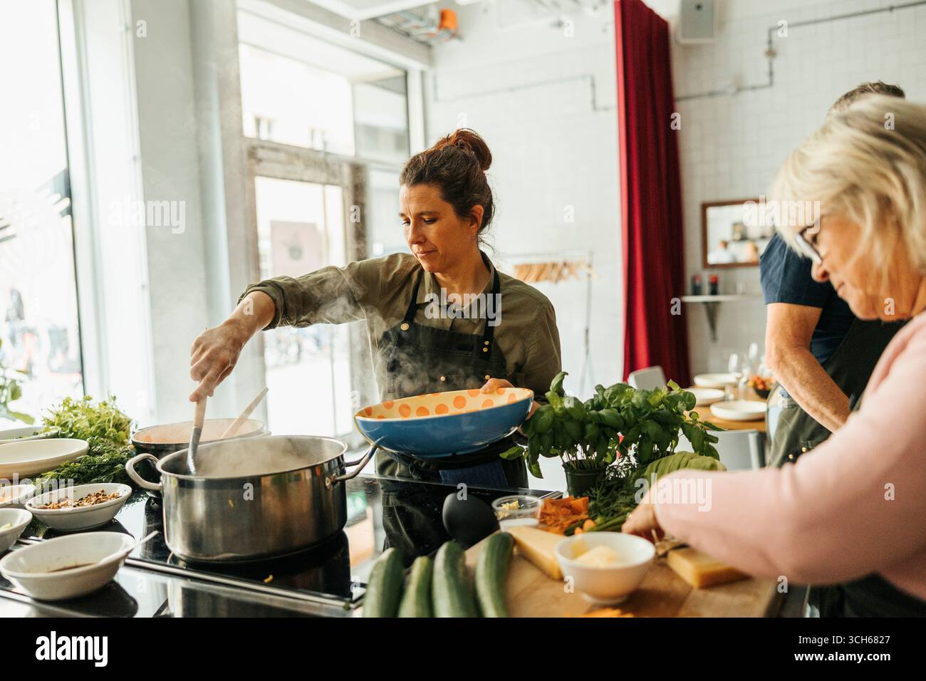 Female chef stirring hot hi-res stock photography and images - Alamy