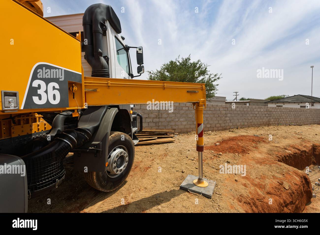Truck-mounted concrete pump, on a construction site to fill with ...