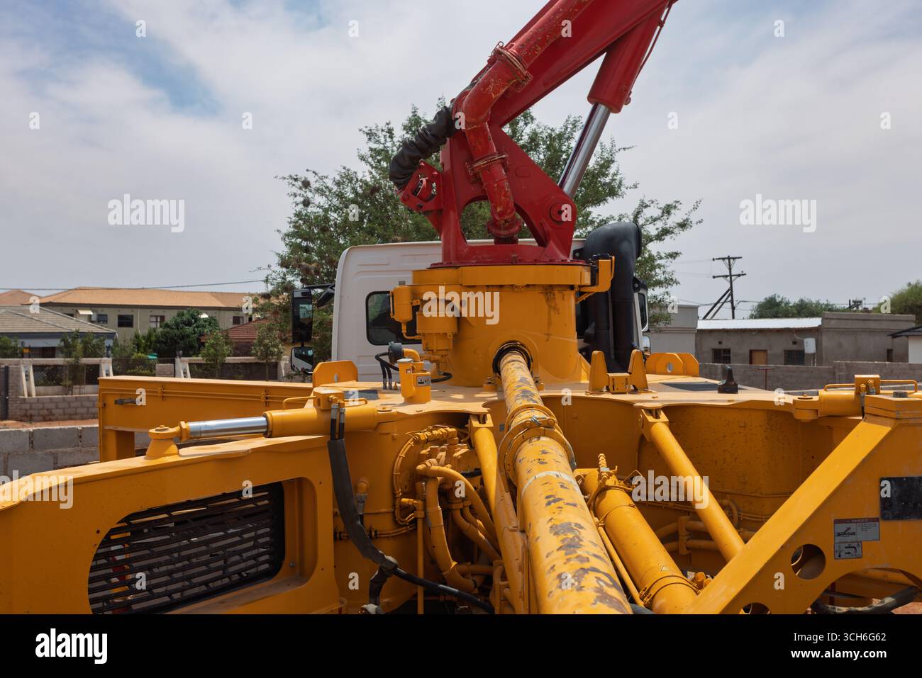 Truck-mounted concrete pump, on a construction site to fill with ...