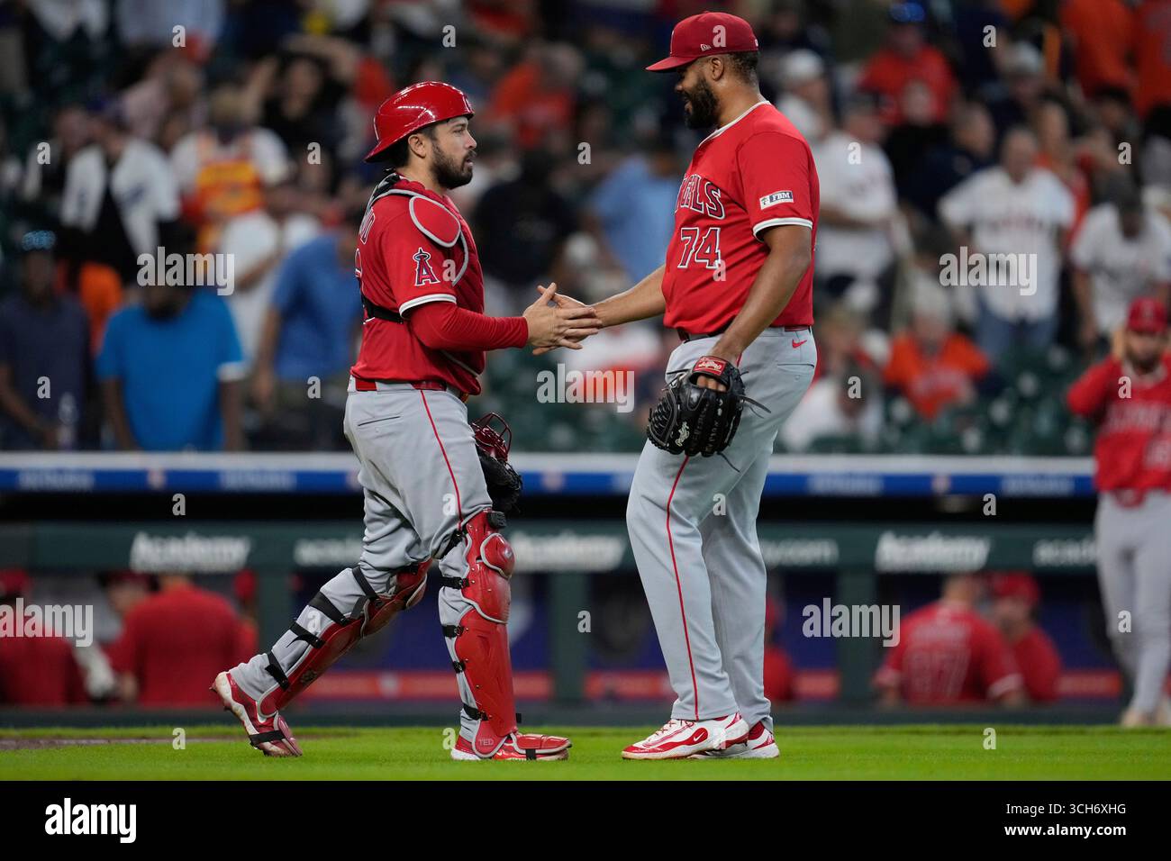 Los Angeles Angels catcher Travis d'Arnaud, left, and relief pitcher ...