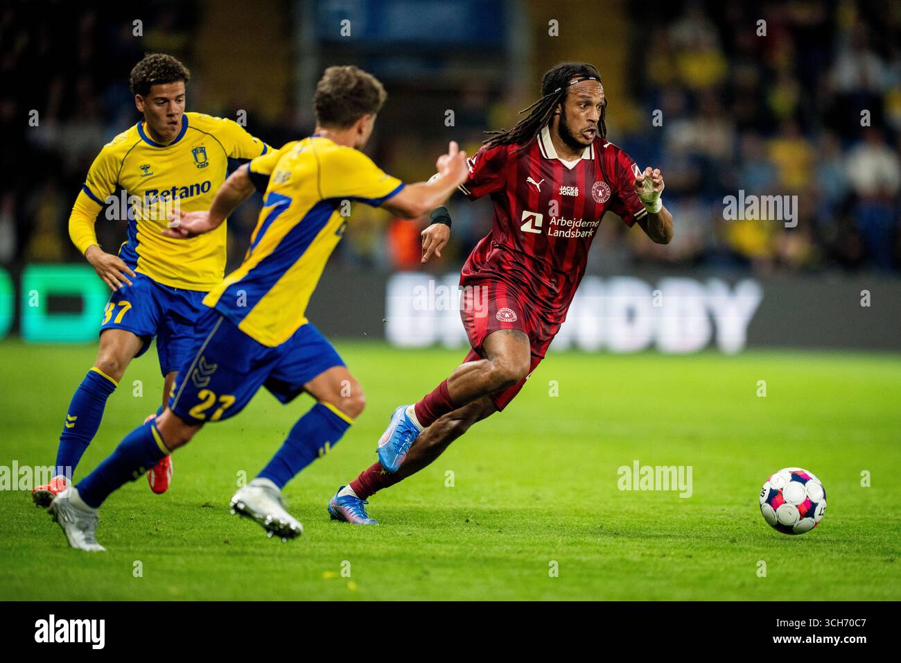 Broendby's Mats Köhlert and Clement Bischoff and FC Midtjylland's Kevin ...