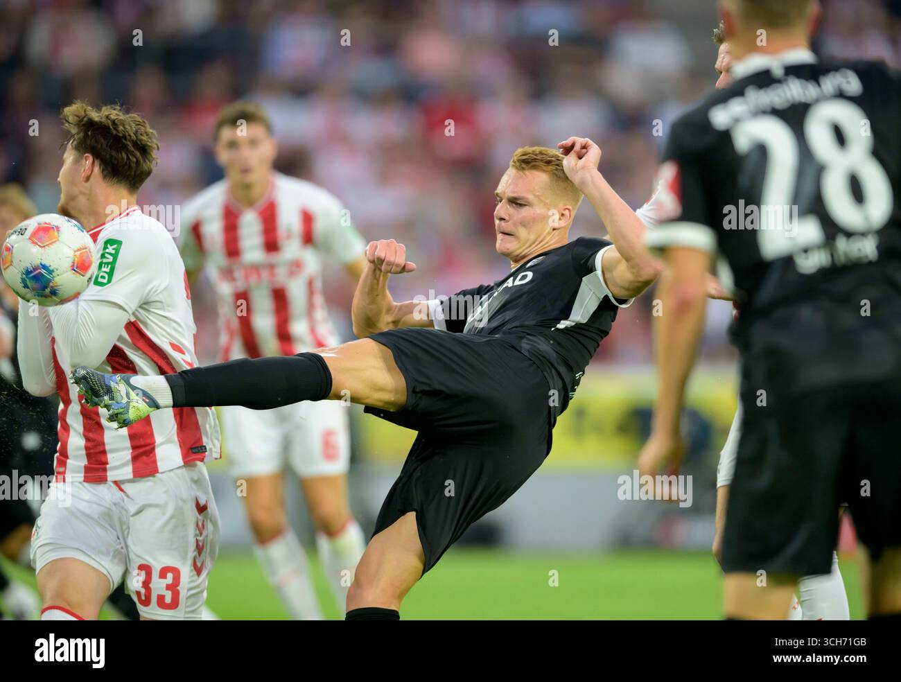 Left to right: Rav van den Berg (FC Cologne), Philipp Lienhart (SC ...