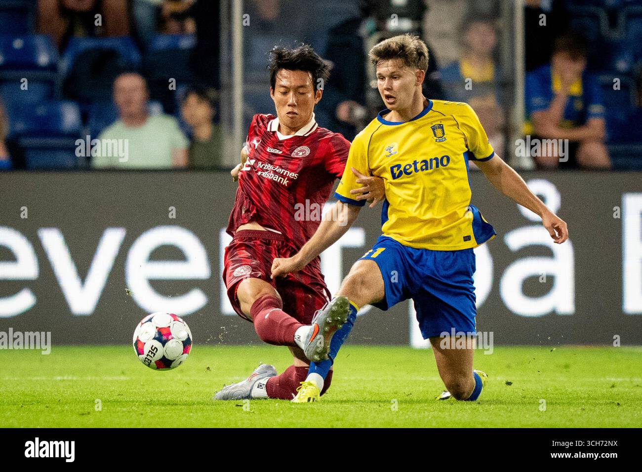 FC Midtjylland's Han-beom Lee and Broendby's Filip Bundgaard during the Superliga match between ...