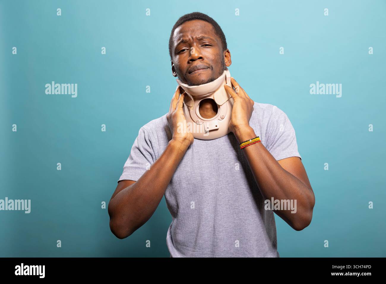 Injured adult using a neck brace to heal from a vertebra fracture ...