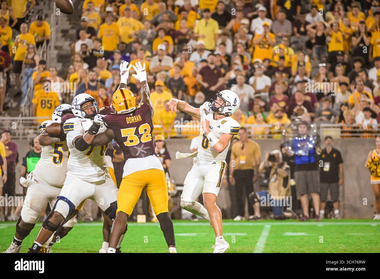 Northern Arizona Lumberjacks quarterback Ty Pennington (6) throws down ...