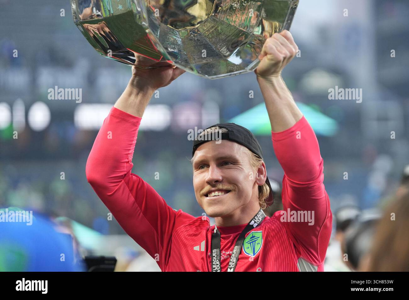 Seattle Sounders FC goalkeeper Andrew Thomas (26) lifts the Leagues Cup ...