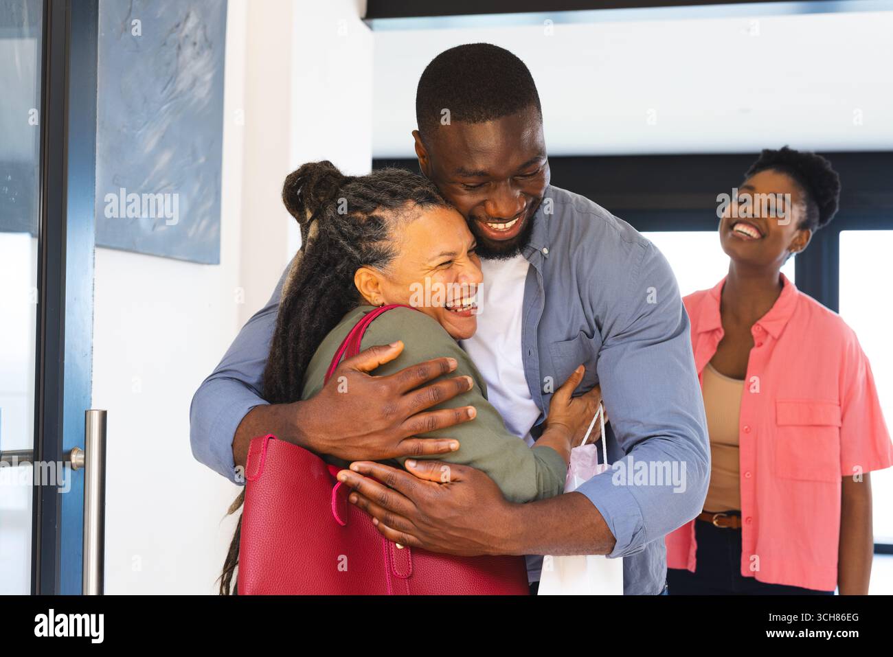 Joyful embrace between two hi-res stock photography and images - Alamy