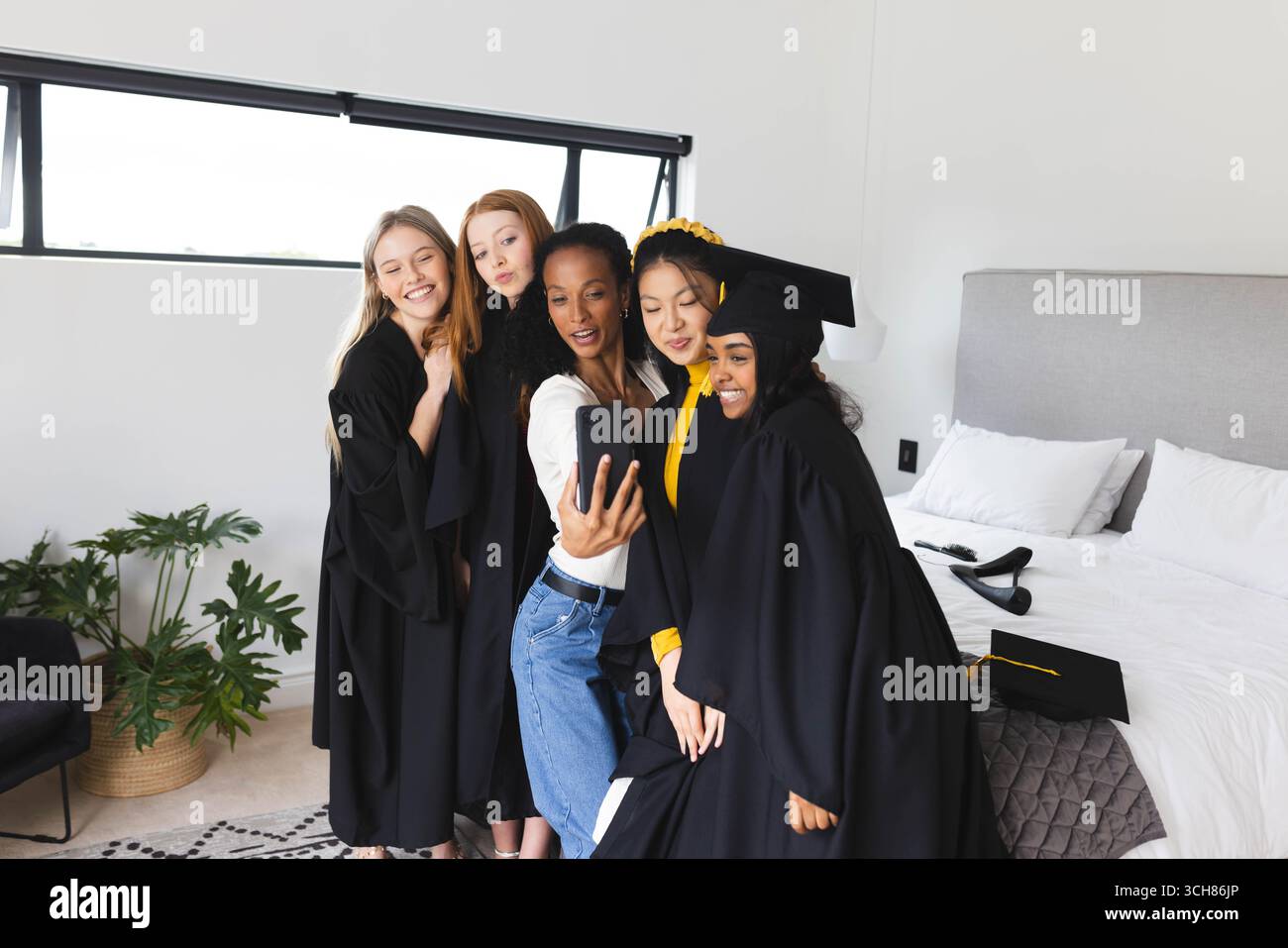 Diverse graduates wearing caps hi-res stock photography and images - Alamy