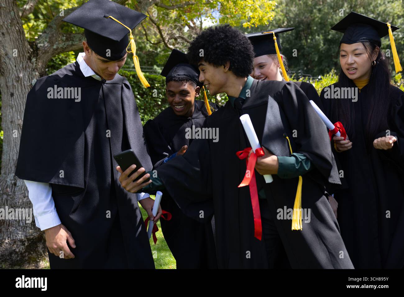 Graduating diverse students taking hi-res stock photography and images ...