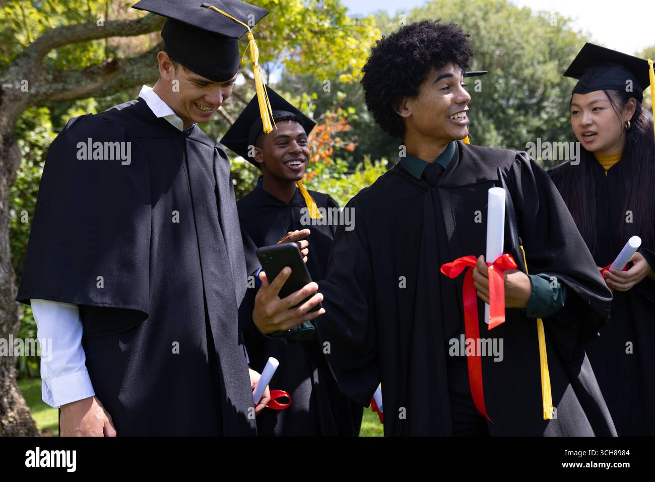 Graduating diverse students taking hi-res stock photography and images ...