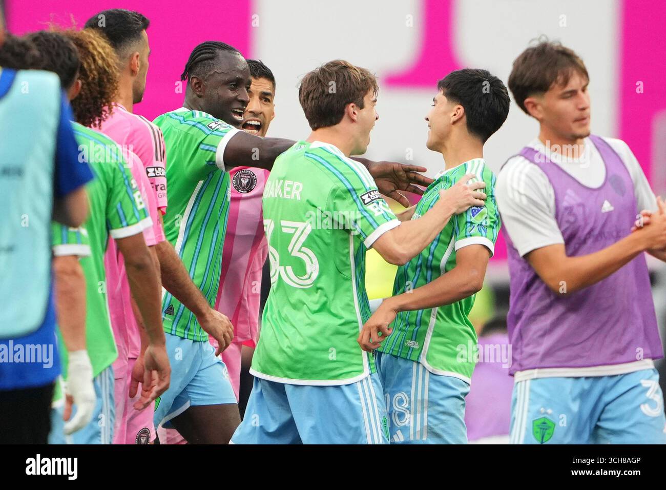 Inter Miami forward Luis Suárez, back center facing, is separated from ...