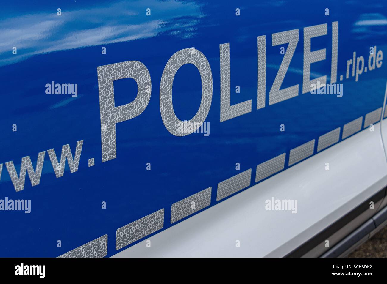 The word “Polizei” is clearly visible on a German police patrol car ...