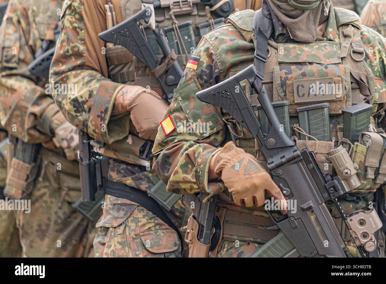 German Bundeswehr soldiers stand in formation wearing combat uniforms ...