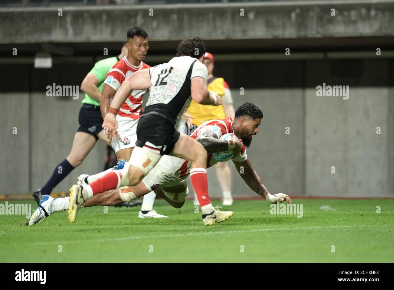 Japan's Amato Fakatava scores their team third try during the 2025 ...