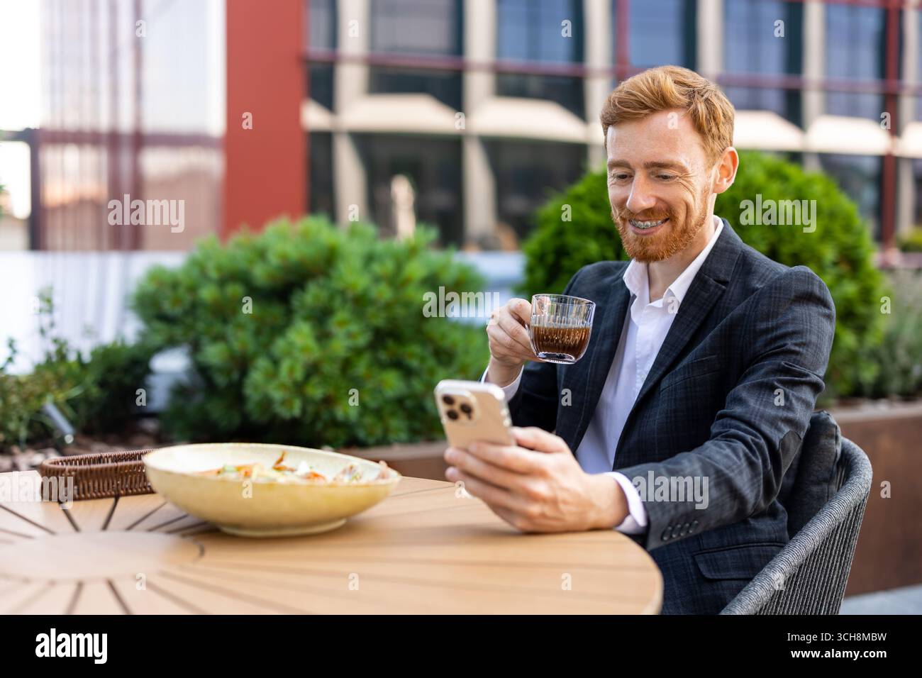 Bearded man scrolling on mobile hi-res stock photography and images - Alamy
