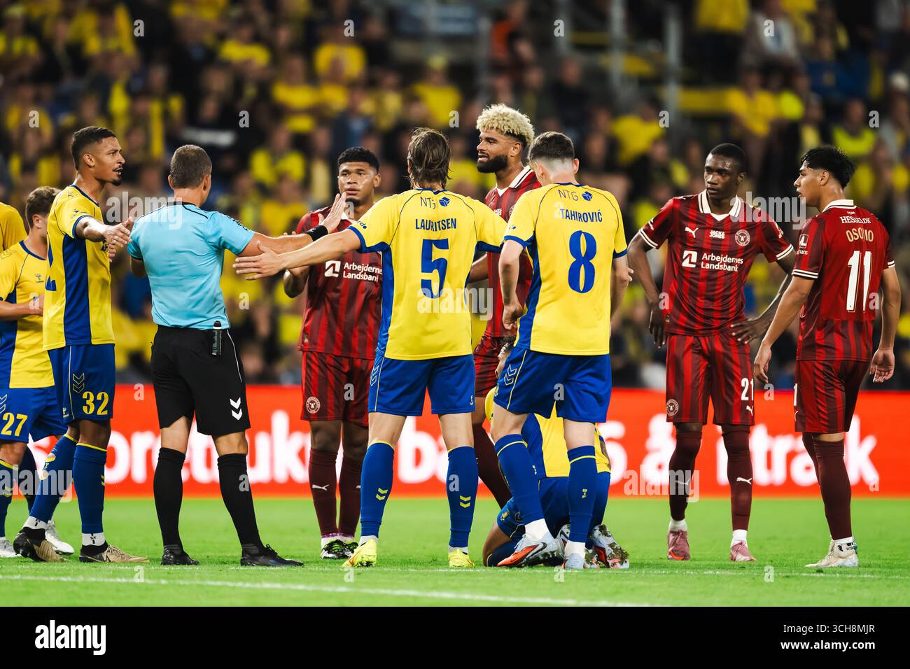 Brondby, Denmark. 31st, August 2025. Referee Morten Krogh is calming ...