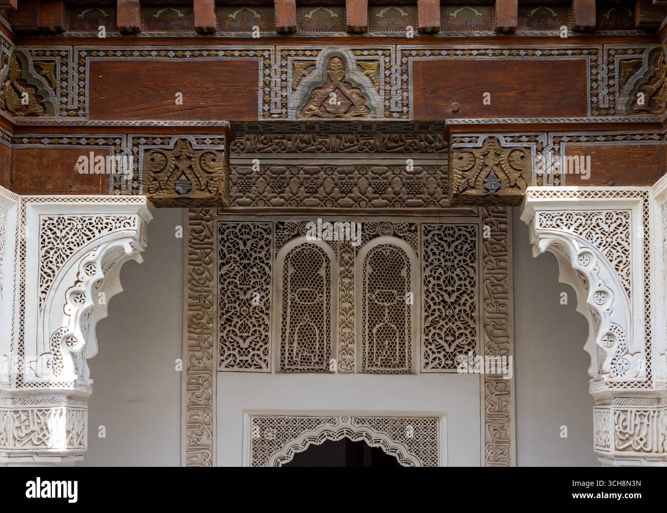 Carved stucco and cedarwood frieze with Arabic calligraphy and small ...