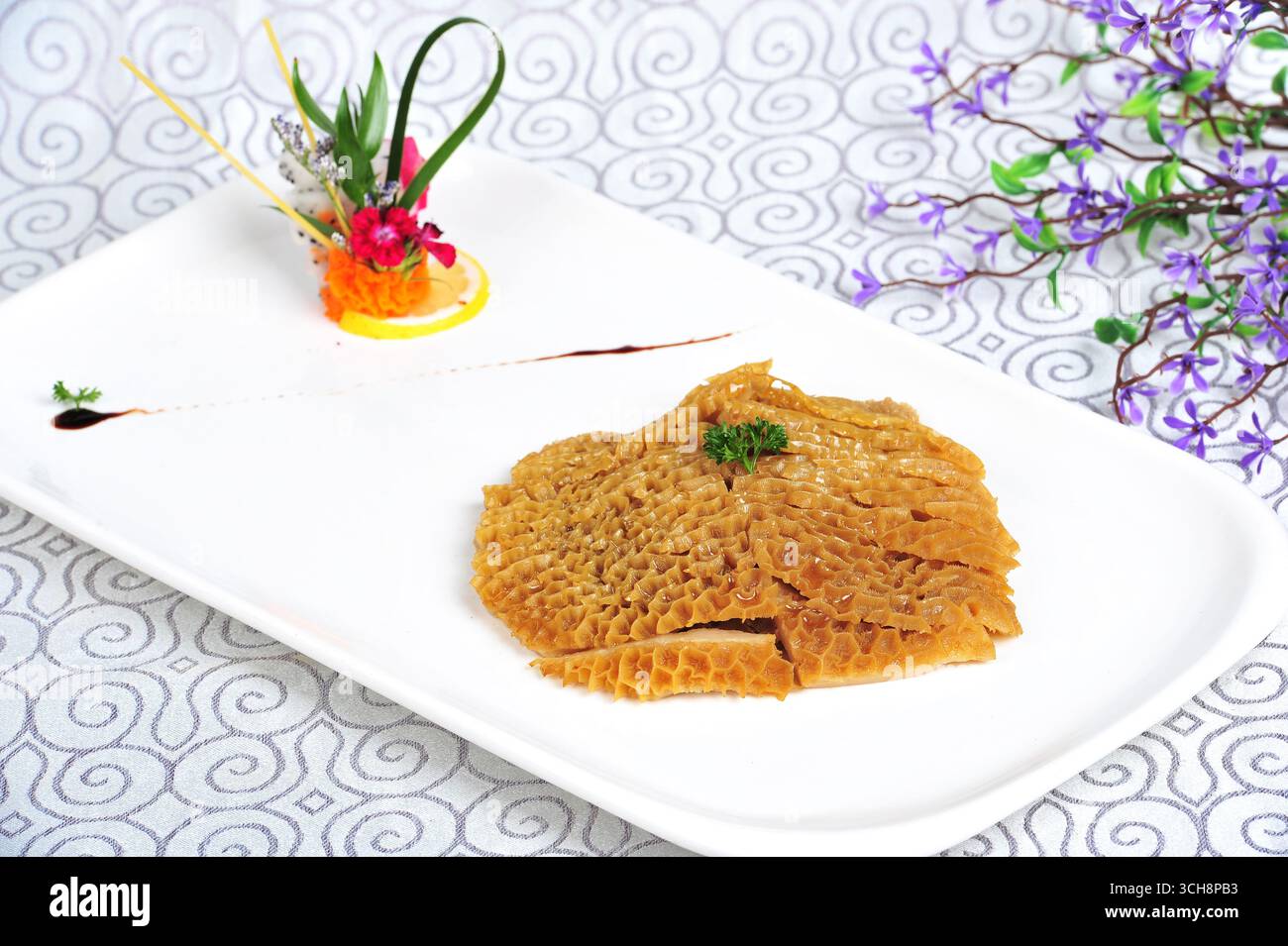 Teochew Soy-Braised Honeycomb Tripe on White Platter Stock Photo - Alamy