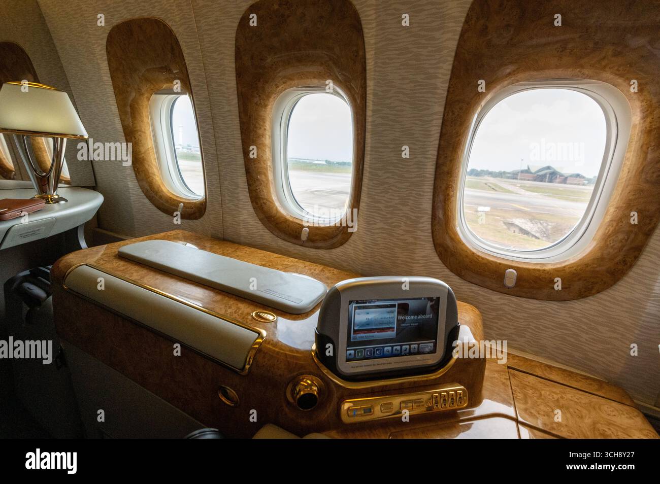 On board an Emirates Boeing 777 self-enclosed 1st class cabin with ...
