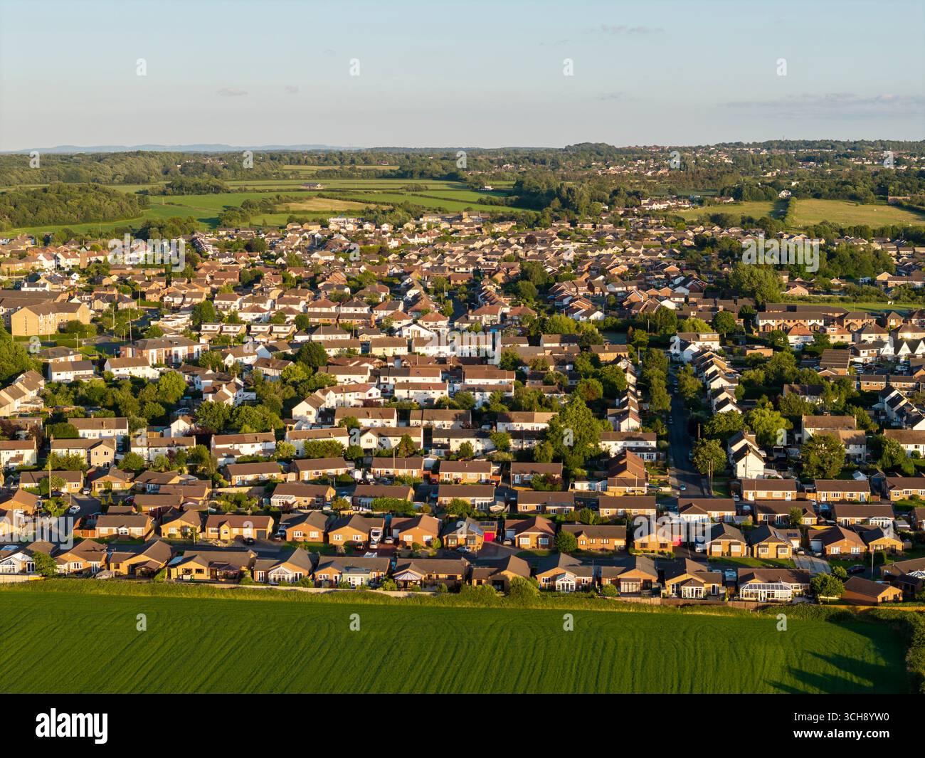 Aerial, residential housing in Greasby with rows of family homes and ...