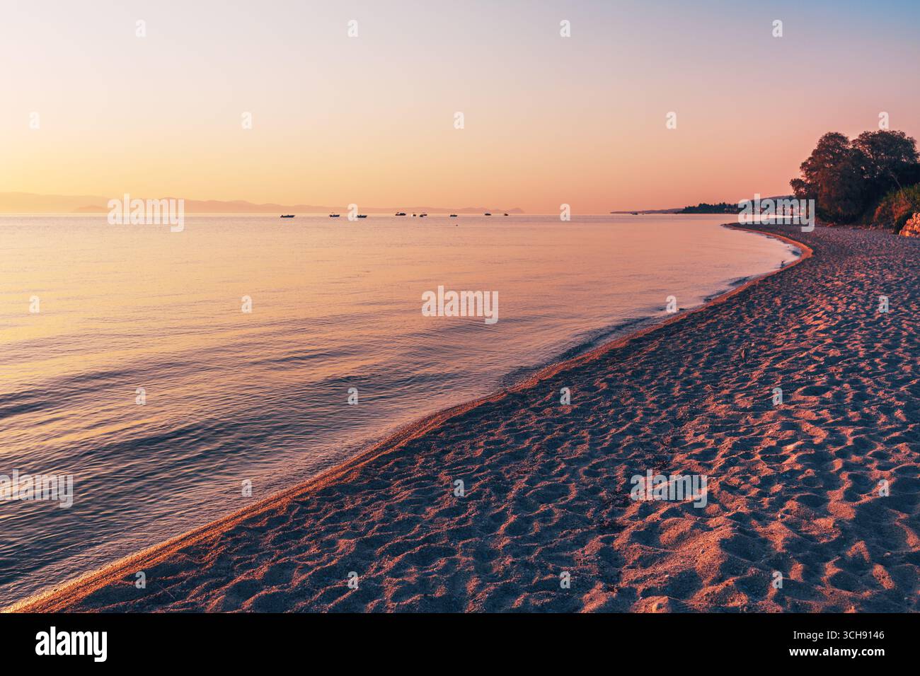 Peaceful sunrise over the calm Aegean Sea at Polychrono, Halkidiki ...
