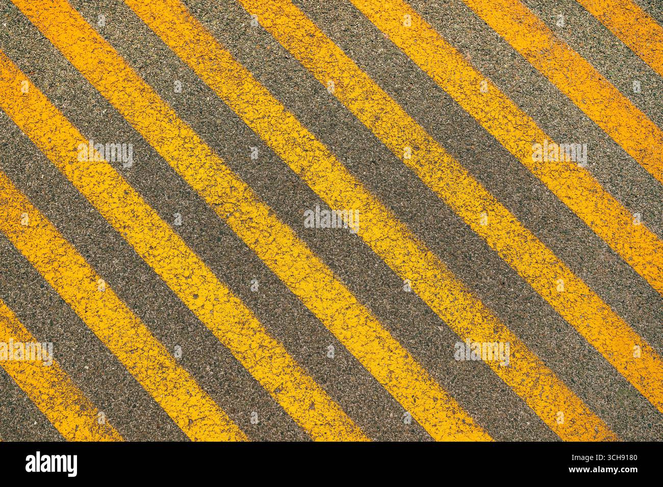 Yellow stripe pattern on asphalt parking lot space for person with ...
