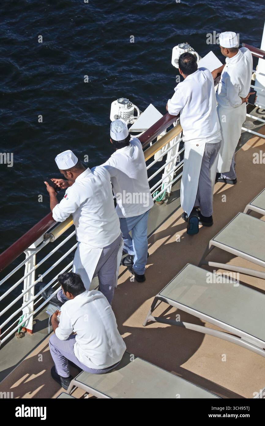 Cruise ship chefs taking a break Stock Photo - Alamy