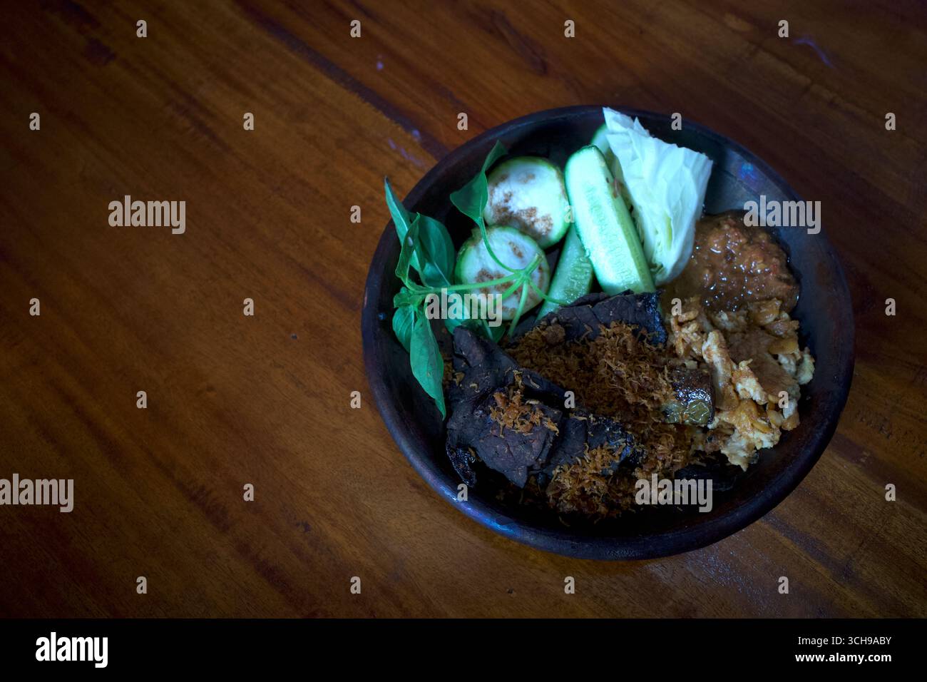 Fried cow lung and shredded coconut with spicy onion chilli sauce and ...