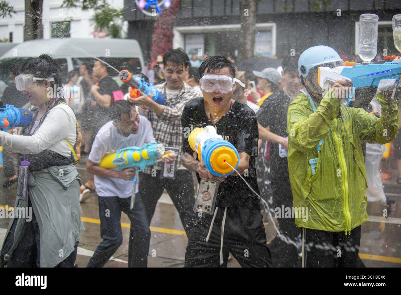 People play with water to celebrate Qixi Festival in Baoting Li and ...