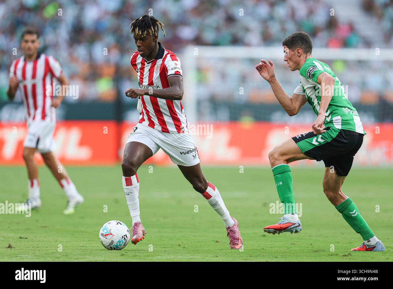 Nico Williams of Athletic Club and Sergi Altimira of Real Betis during ...