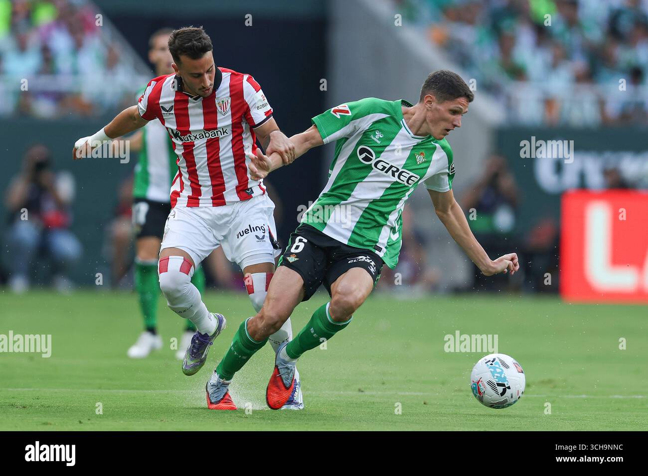 Sergi Altimira of Real Betis and Alex Berenguer of Athletic Club during ...