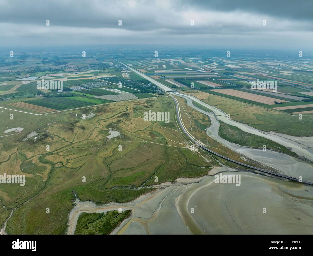 Aerial view of winding waterways carve through the landscape ...