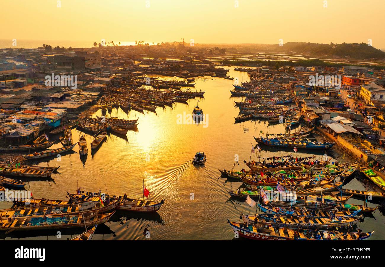 Aerial view of vibrant boats clustered densely in the harbour ...