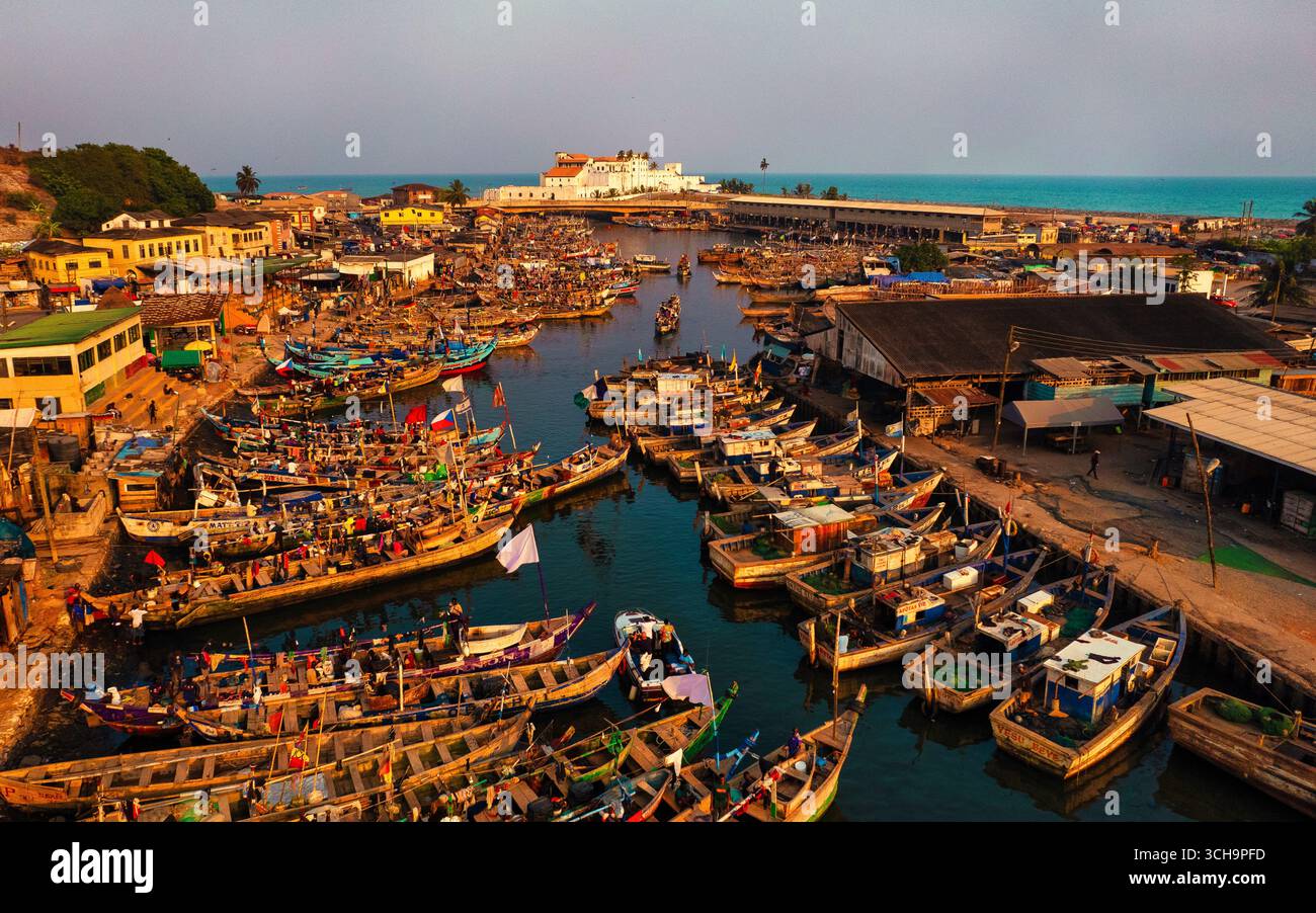 Aerial view of a bustling harbor filled with colorful fishing boats ...