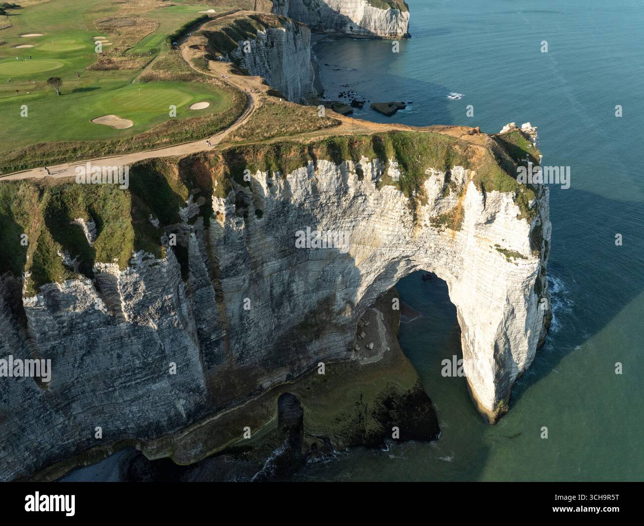 Aerial view of dramatic chalk cliffs plunge into the sea, the iconic ...