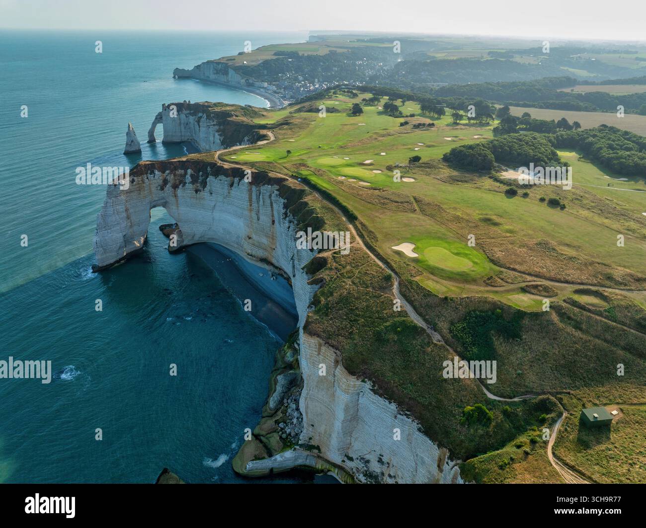 Aerial view of the dramatic cliffs of Étretat, where the iconic arches ...