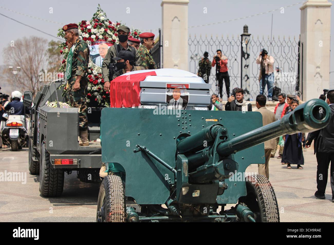 The coffin of Houthi Prime Minister Ahmed al-Rahawi, draped in a Yemeni ...