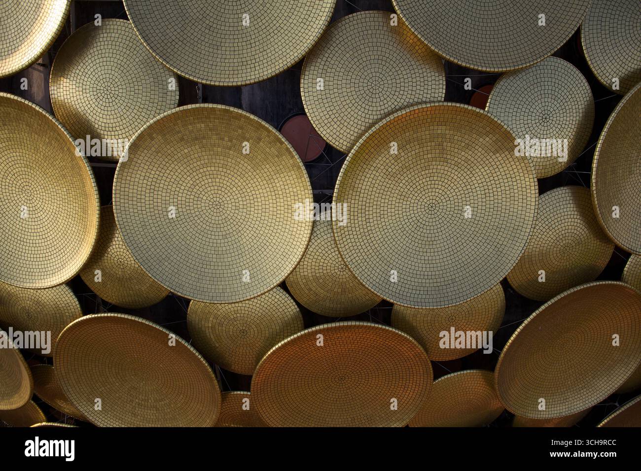 Aerial view of golden discs overlapping, creating a mesmerizing ...