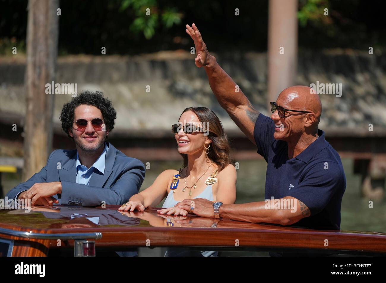 Director Benny Safdie, from left, Emily Blunt and Dwayne Johnson arrive ...