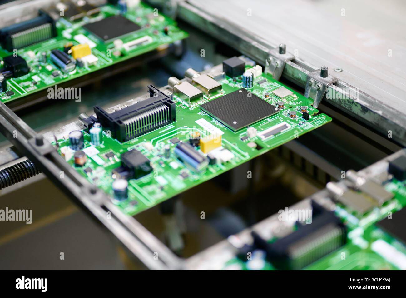 Electronic boards moving efficiently on the conveyor belt in an ...