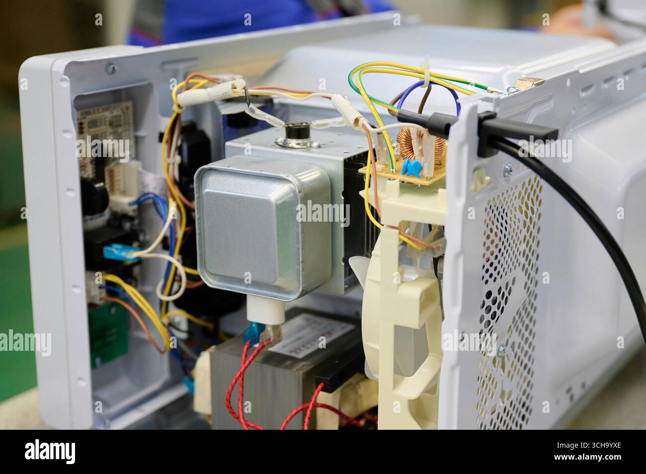 Assembly process at a household microwave oven manufacturing plant ...